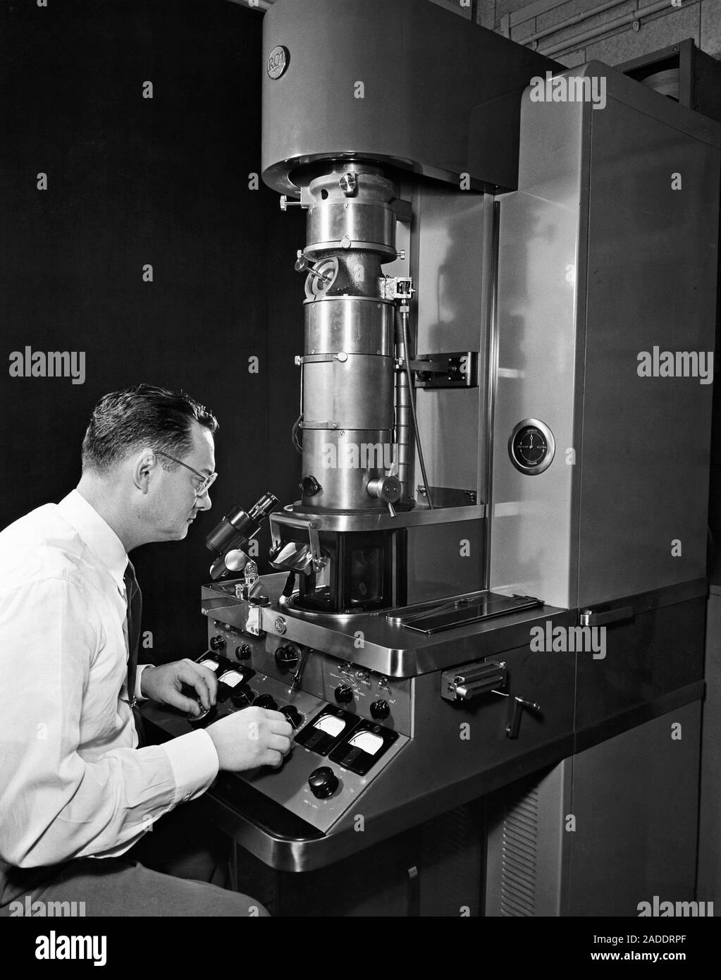 Transmission electron microscopy, 1950s. Research chemist using a ...