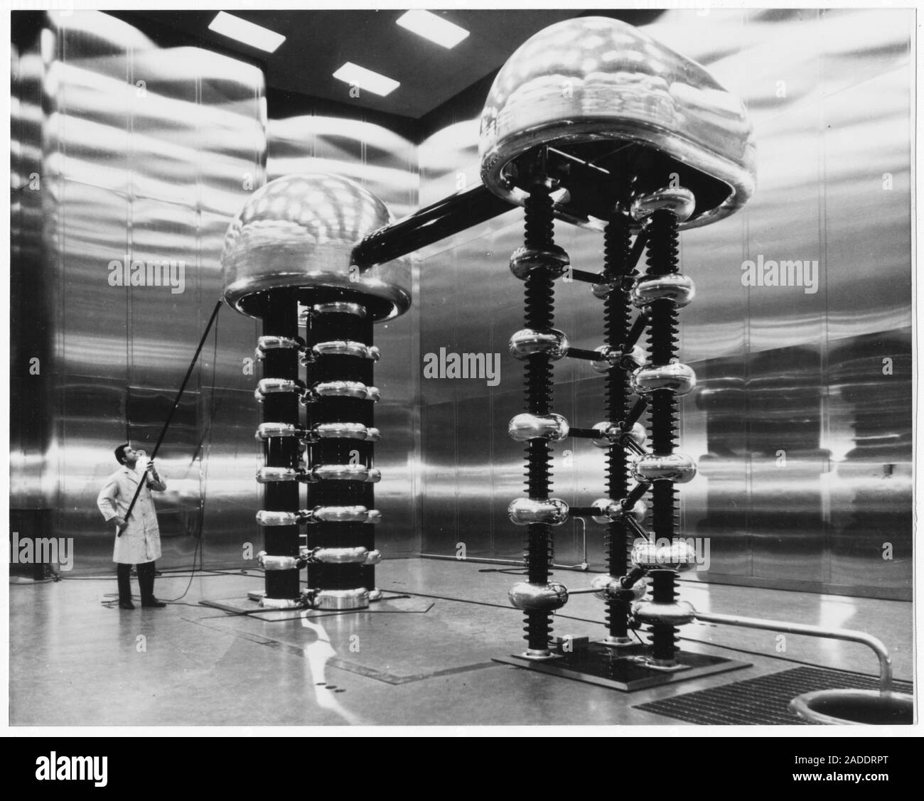 High-voltage generator for electron microscope. Laboratory worker ...