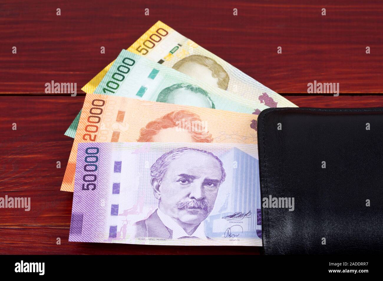 Costa Rican money - Colon in the black wallet Stock Photo - Alamy