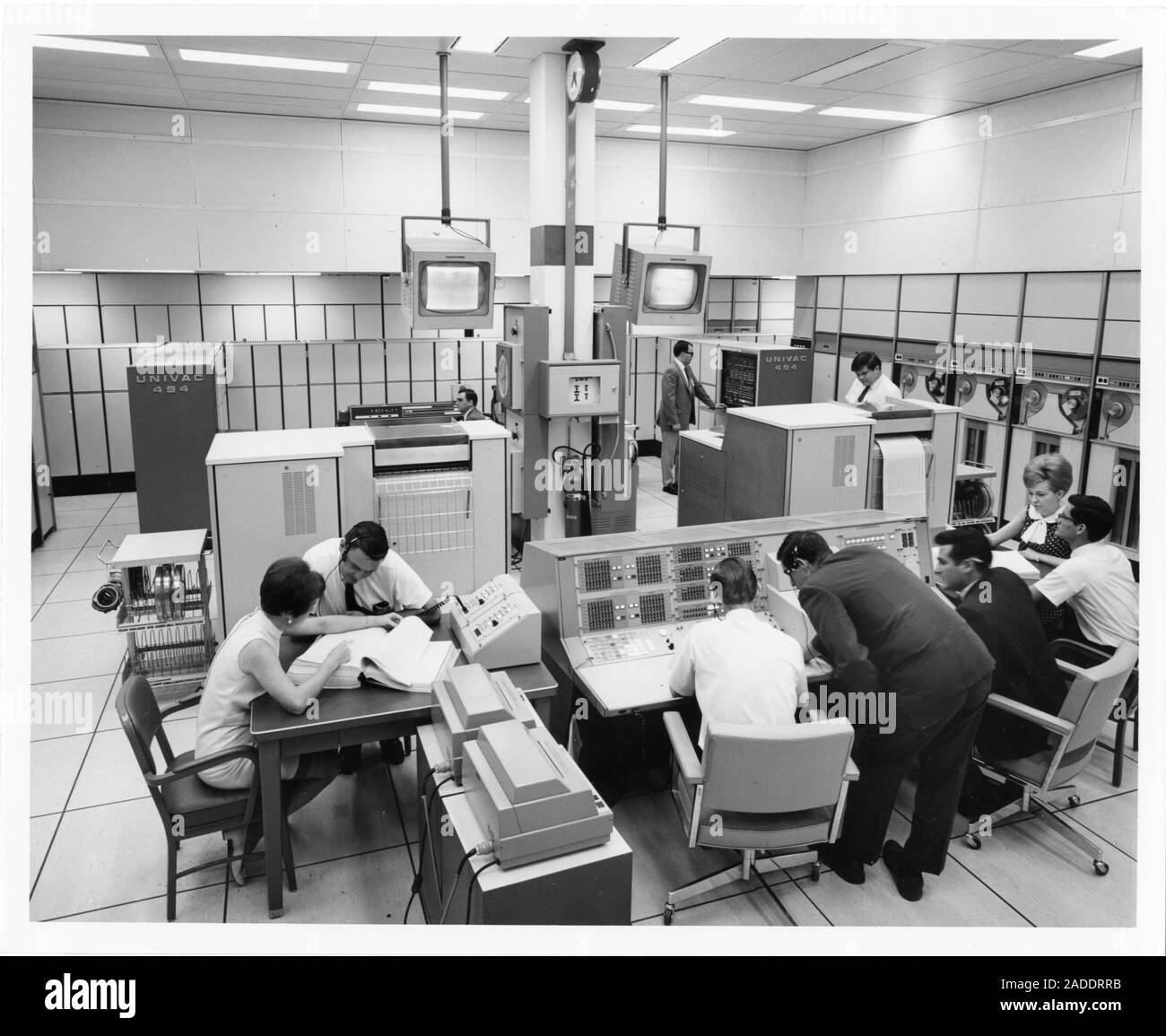 UNIVAC 494 computer operators at NASA, 1960s. The computer model being ...