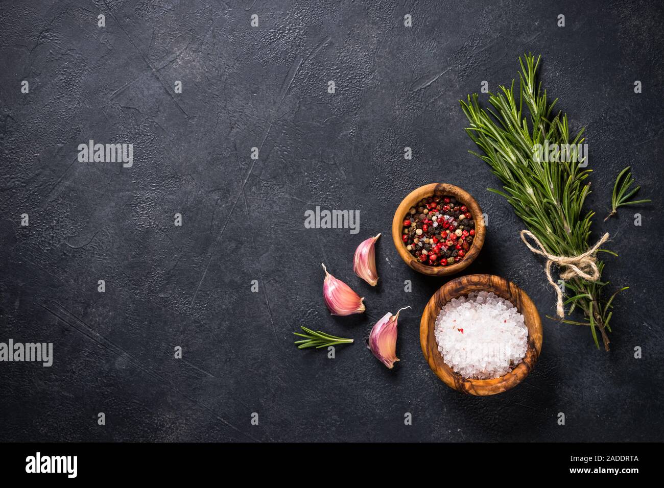 Food cooking background with herbs and spices on black Stock Photo - Alamy