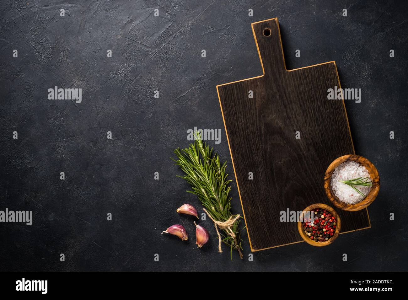 Food cooking background with herbs and spices on black Stock Photo - Alamy