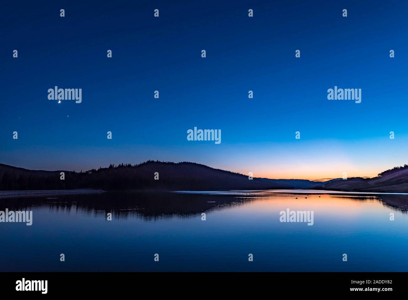 Waxing 5-day-old crescent Moon above Jupiter in the darkening twilight ...
