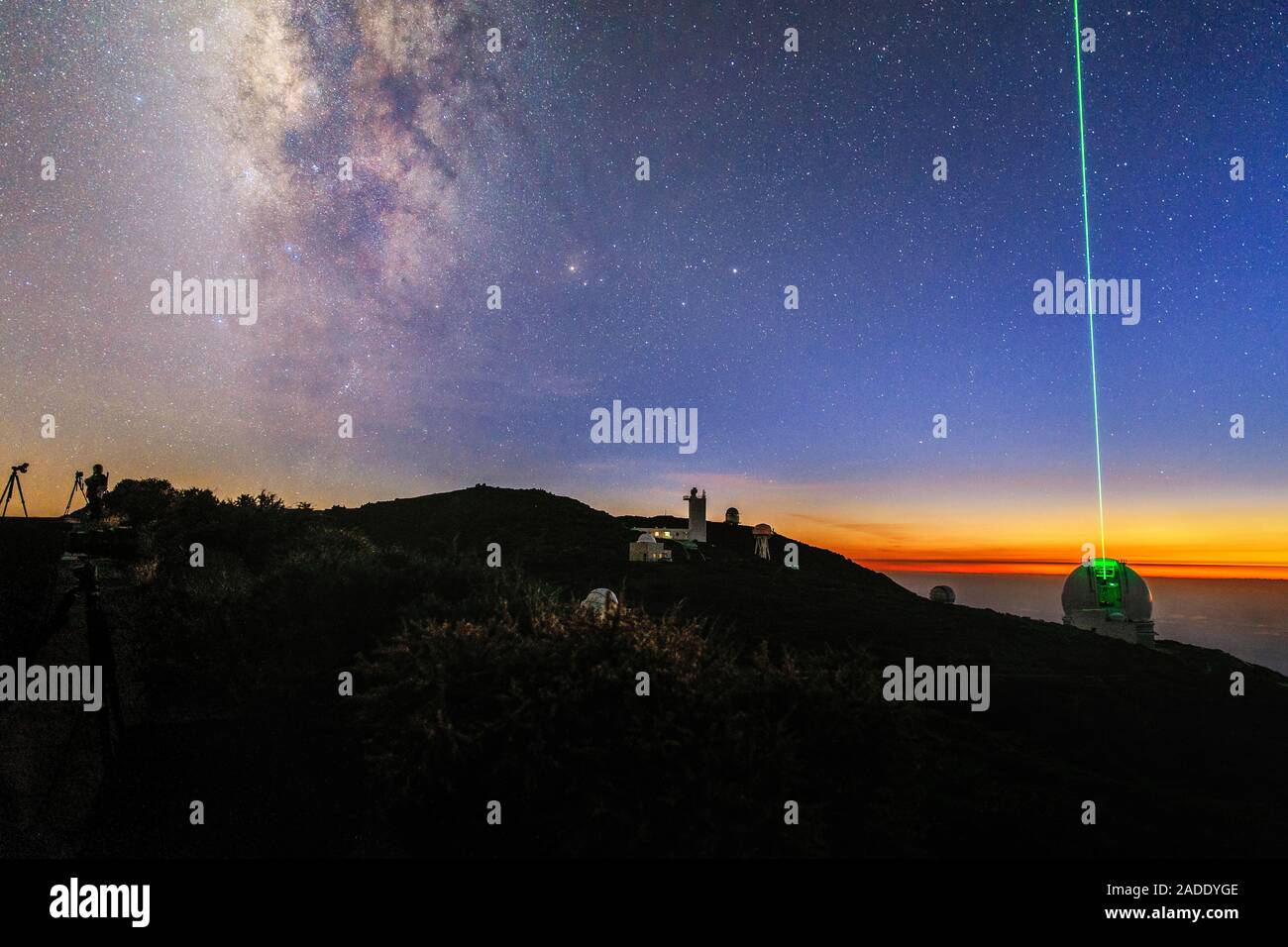 Milky Way and laser guide star at twilight. At right is a laser guide ...