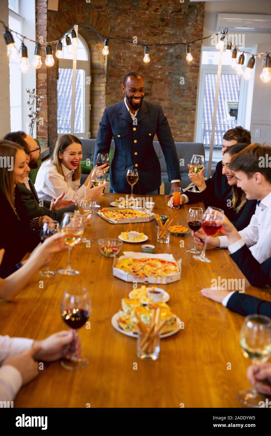 Happy co-workers celebrating while company party, corporate event ...