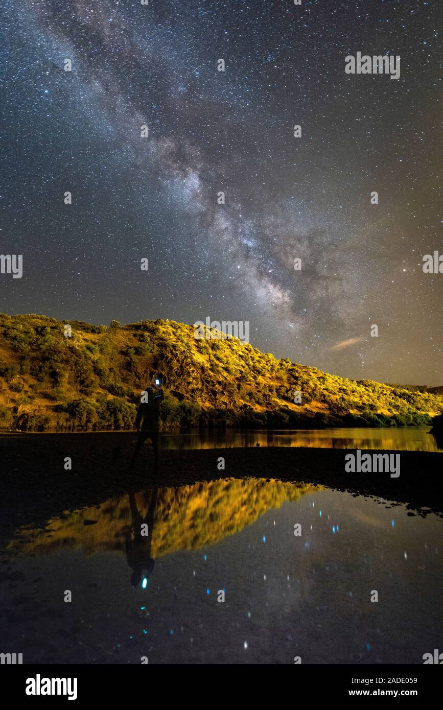 Observing the Milky Way. Amateur astronomer using a smartphone to ...