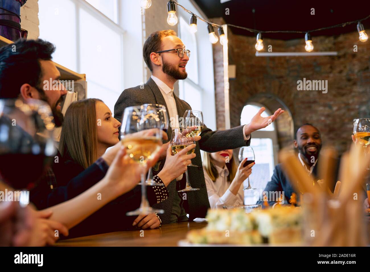 Happy co-workers celebrating while company party and corporate event ...