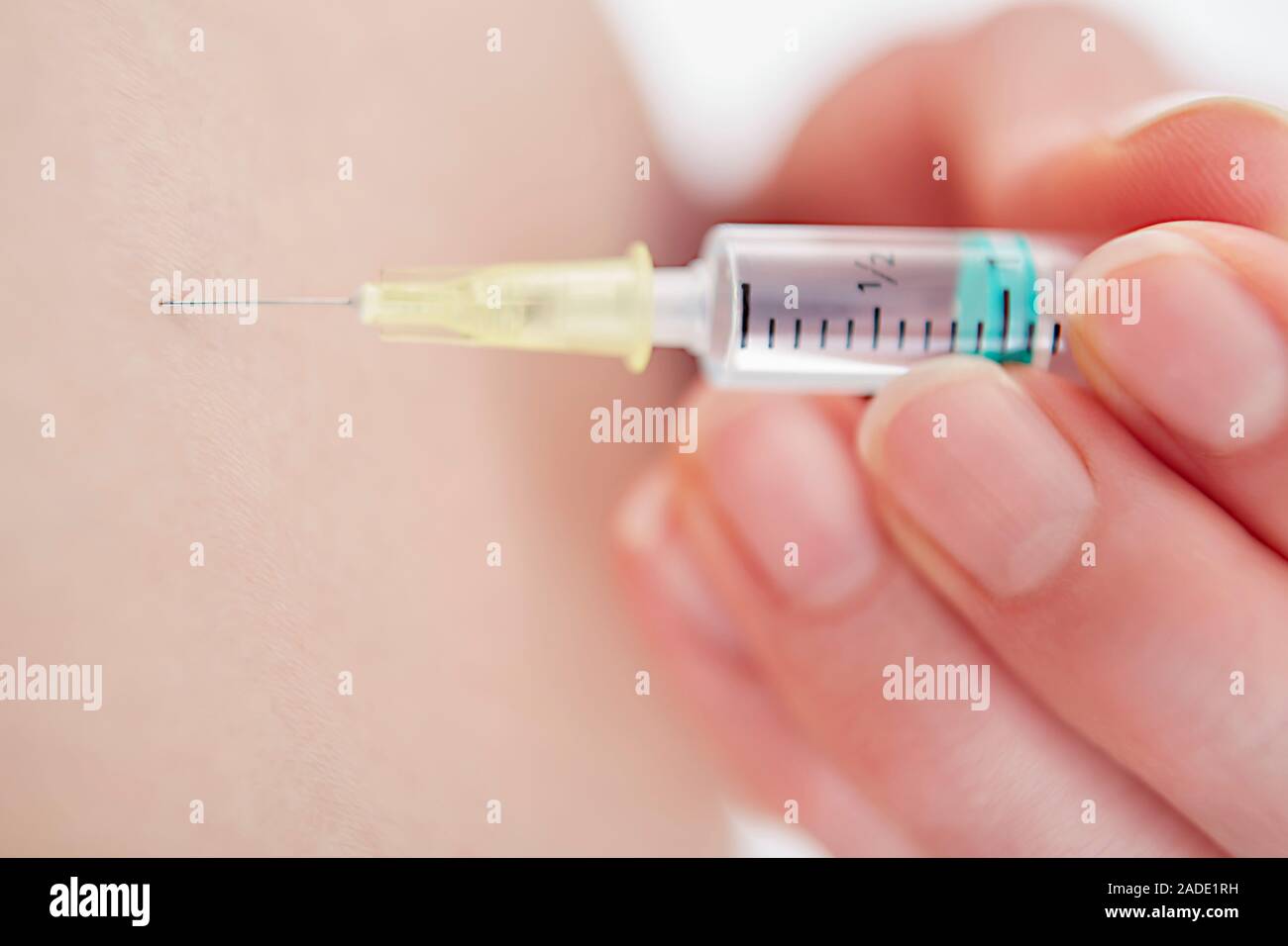 Self injection for in vitro fertilisation (IVF). Close-up of a woman ...