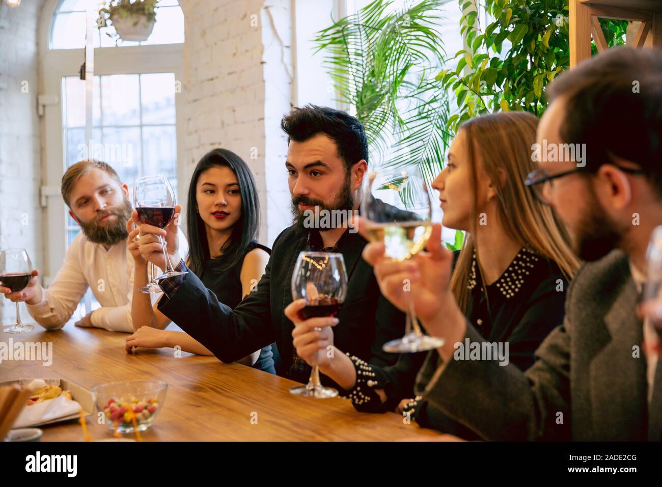 Happy co-workers celebrating while company party, corporate event ...