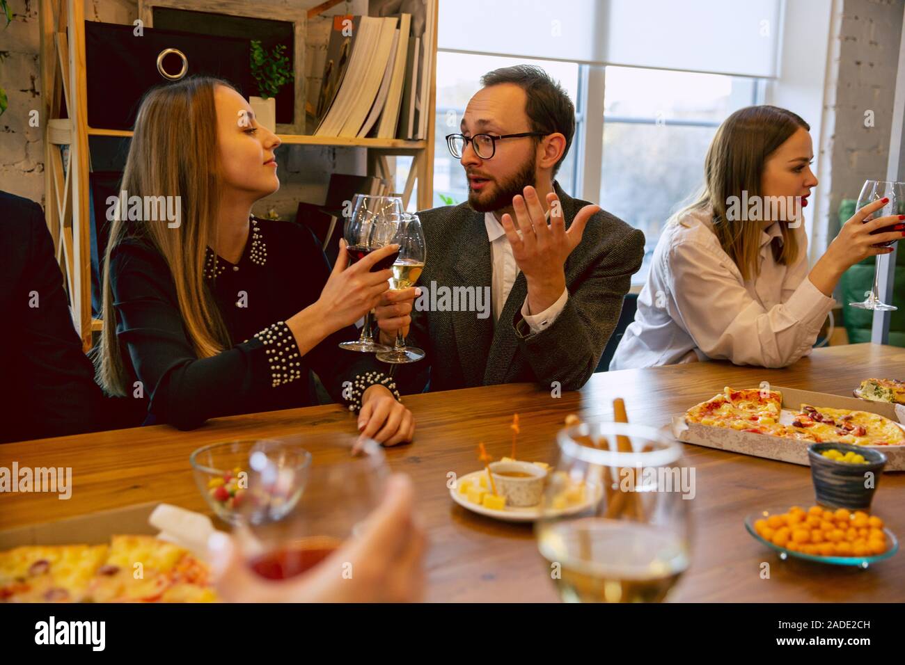 Happy co-workers celebrating while company party, corporate event ...
