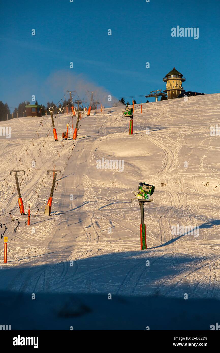 Feldberg, Germany. 04th Dec, 2019. Snow cannons snow a slope between ...