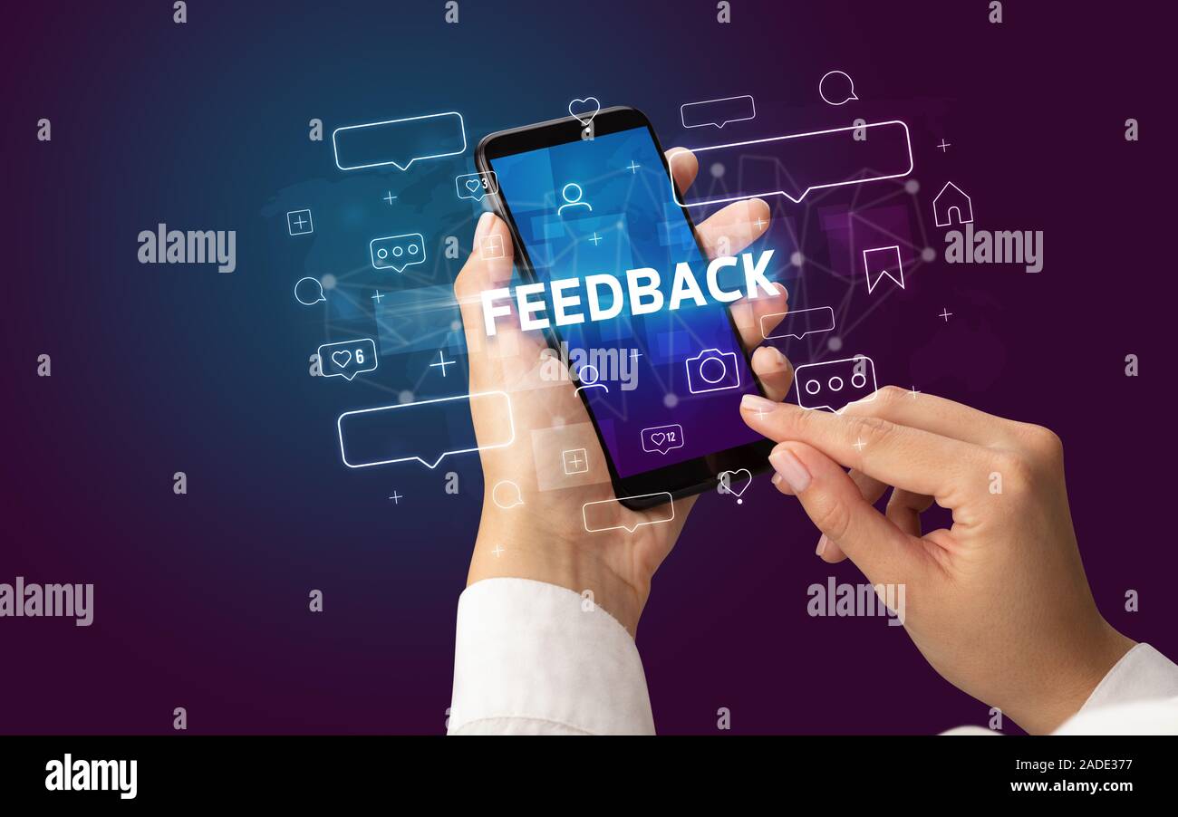 Female hand typing on smartphone with FEEDBACK inscription, social ...