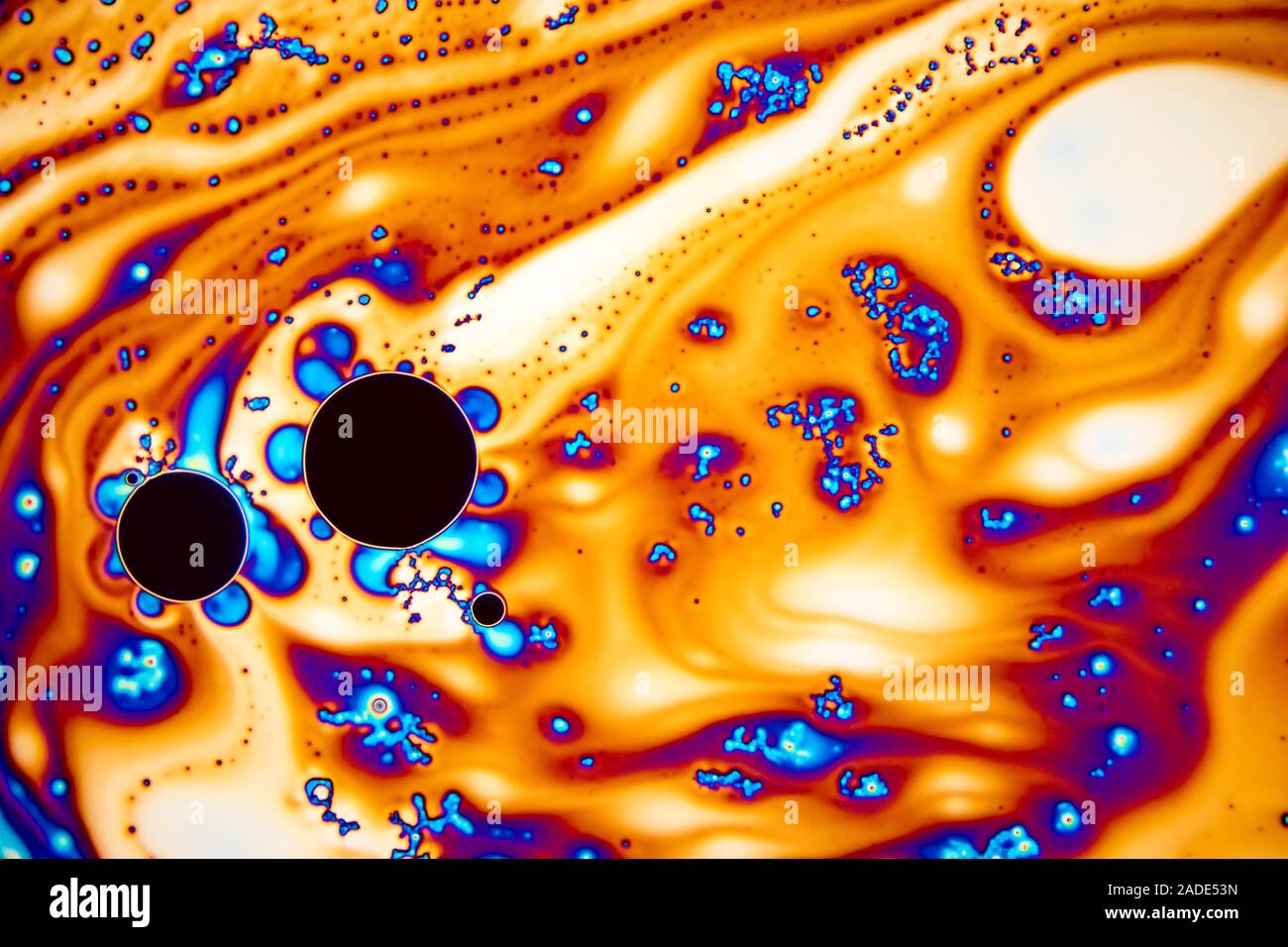 Soap bubble film iridescence. Light micrograph of the surface of a ...