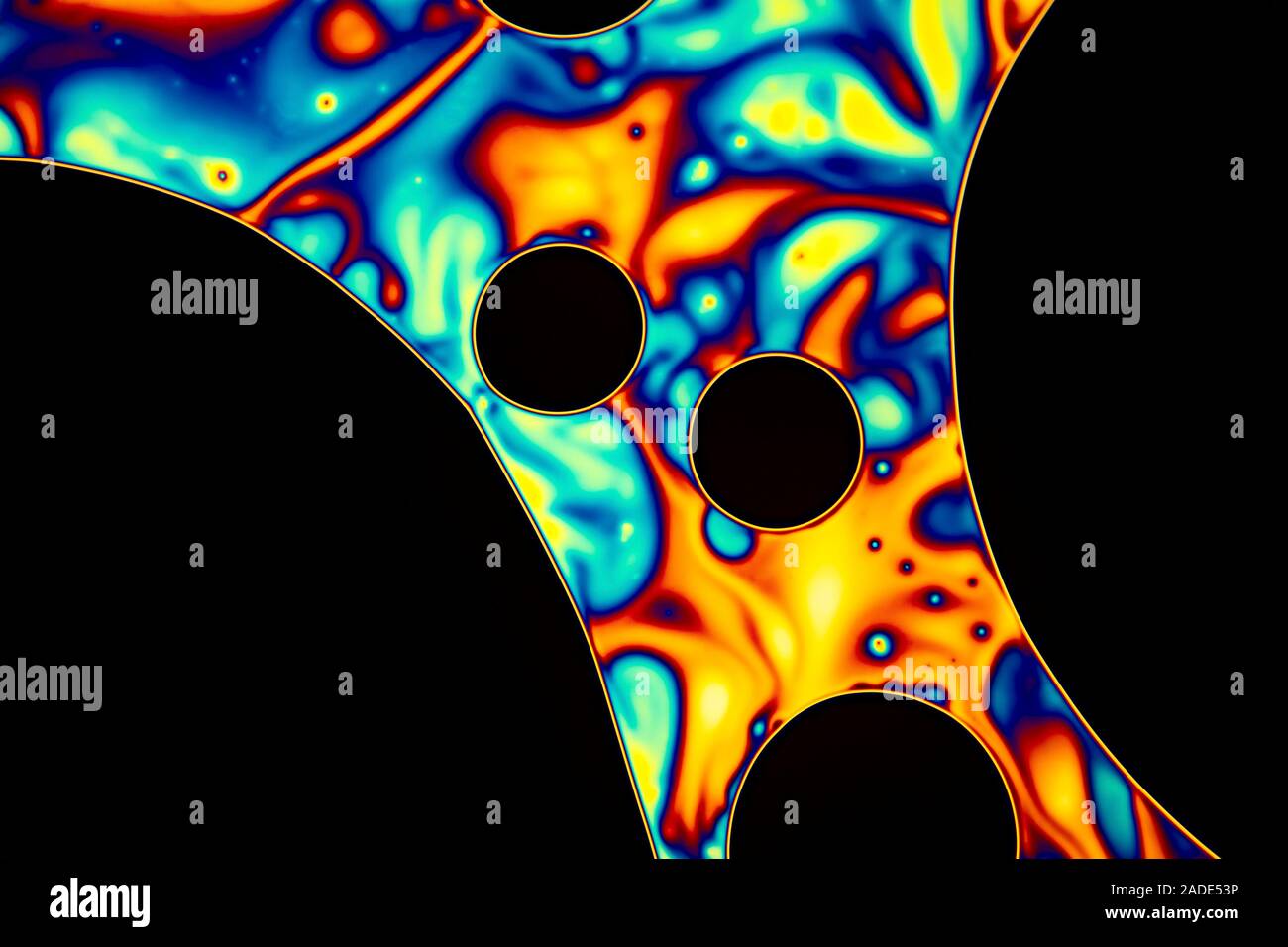 Soap bubble film iridescence. Light micrograph of the surface of a ...