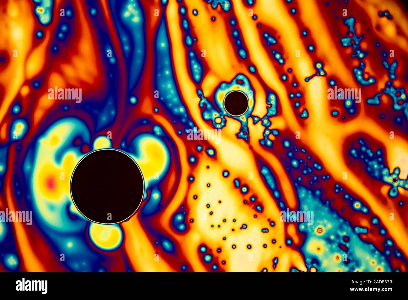 Soap bubble film iridescence. Light micrograph of the surface of a ...