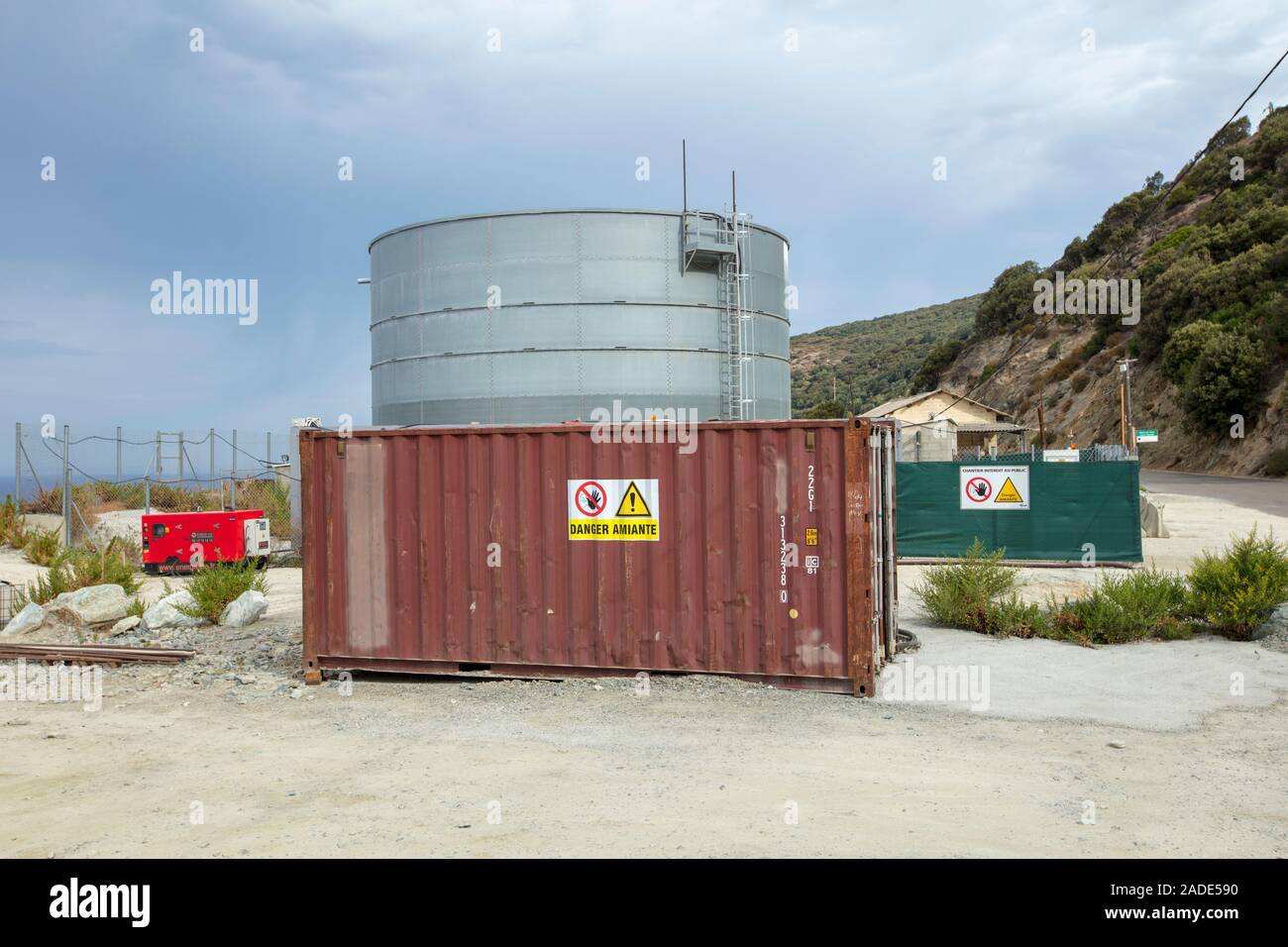 Canari asbestos plant. Storage tank at the Canari asbestos mine and ...