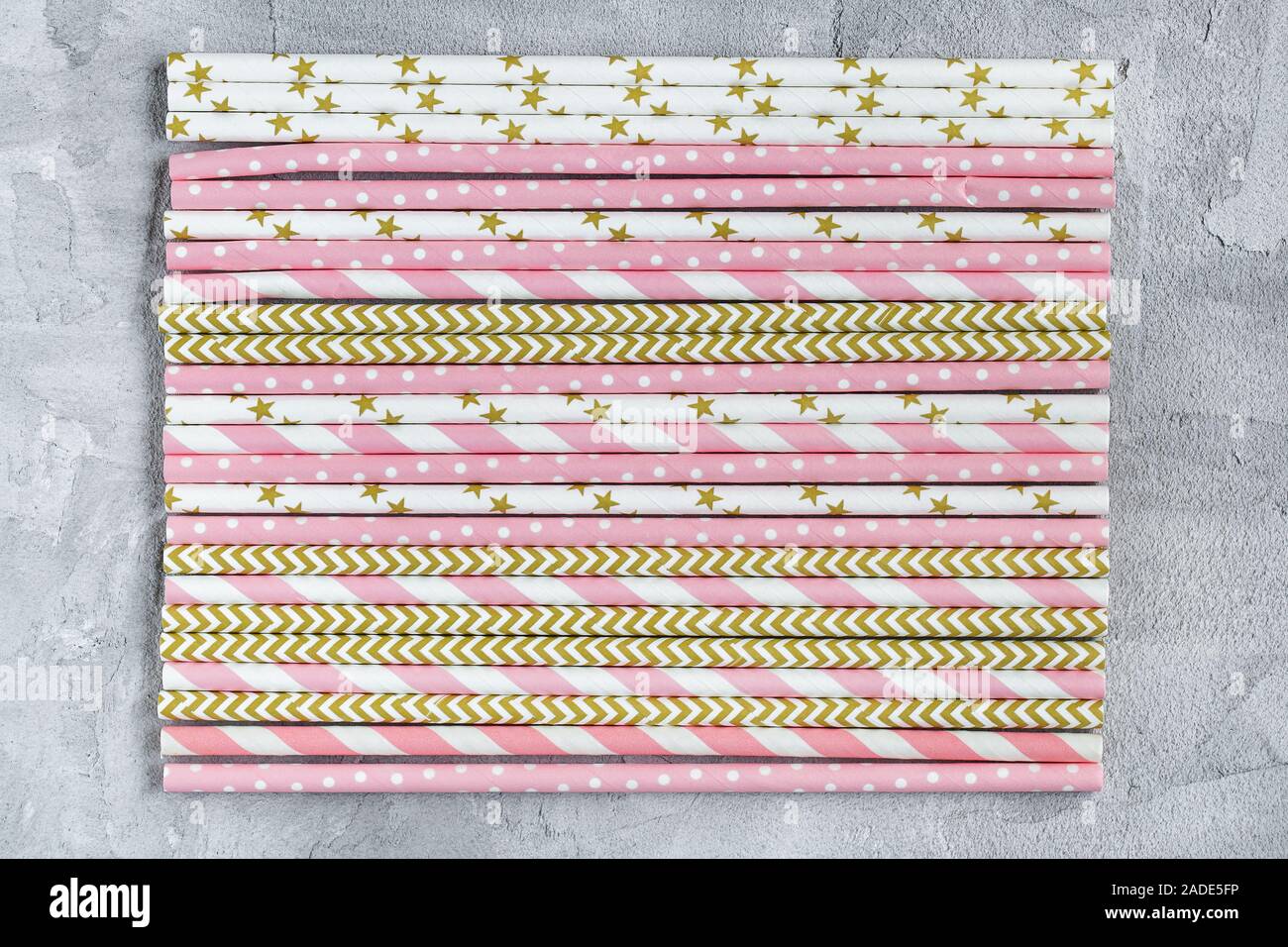 Paper straws on a grey background. Celebration concept Stock Photo - Alamy