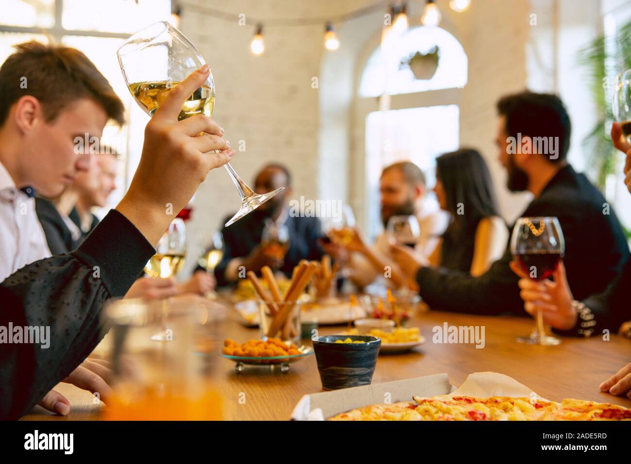 Happy co-workers celebrating while company party, corporate event ...