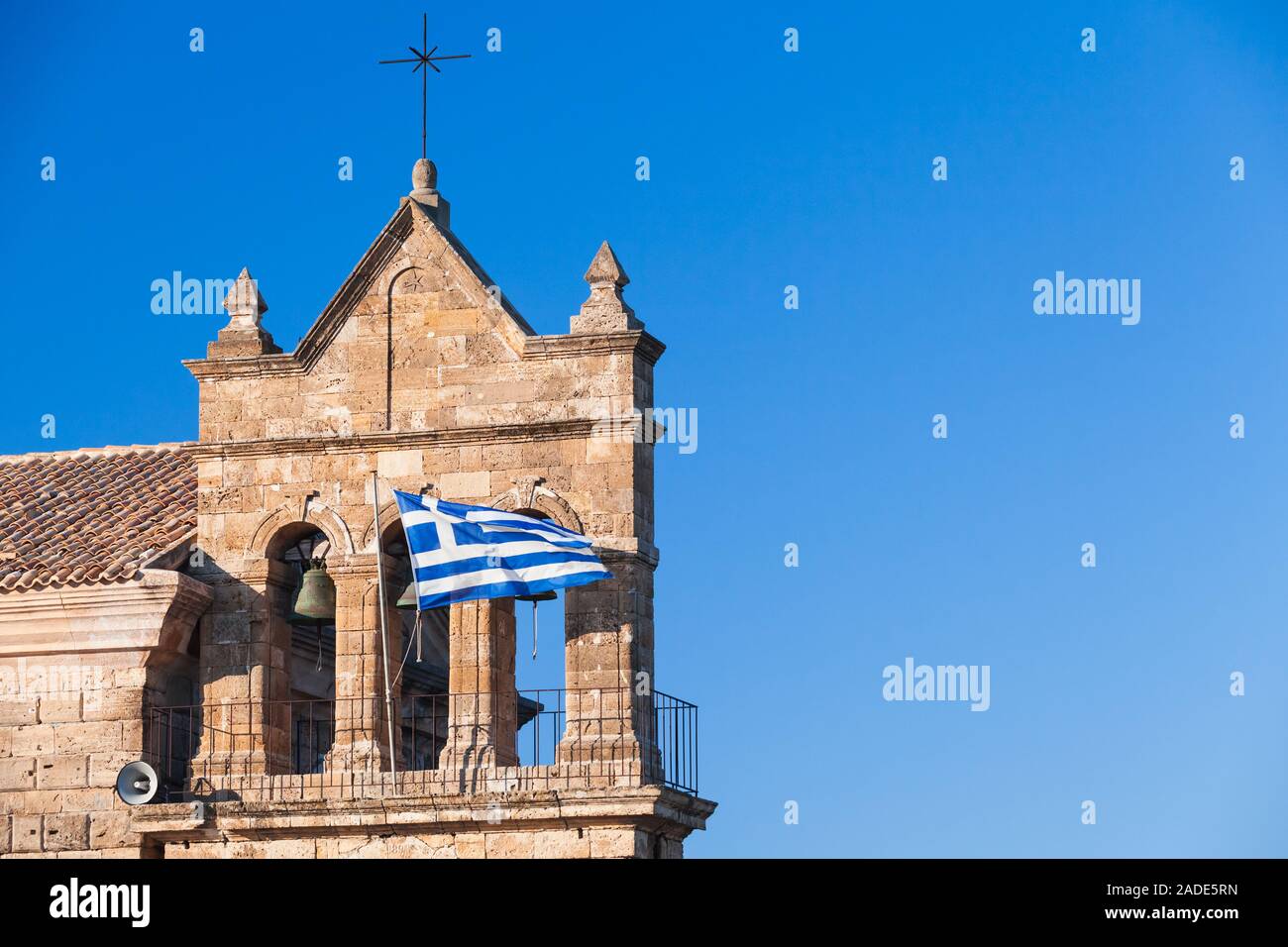 Greek flag on belfry of Saint Nicholas Molou Church on Solomos Square ...