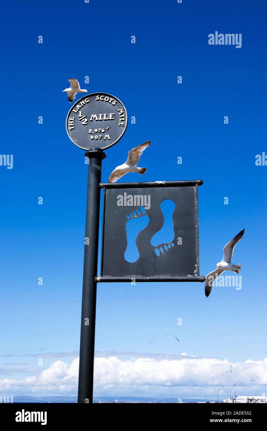 A half-mile sign on the promenade at Ayr, Scotland, indicating the half ...