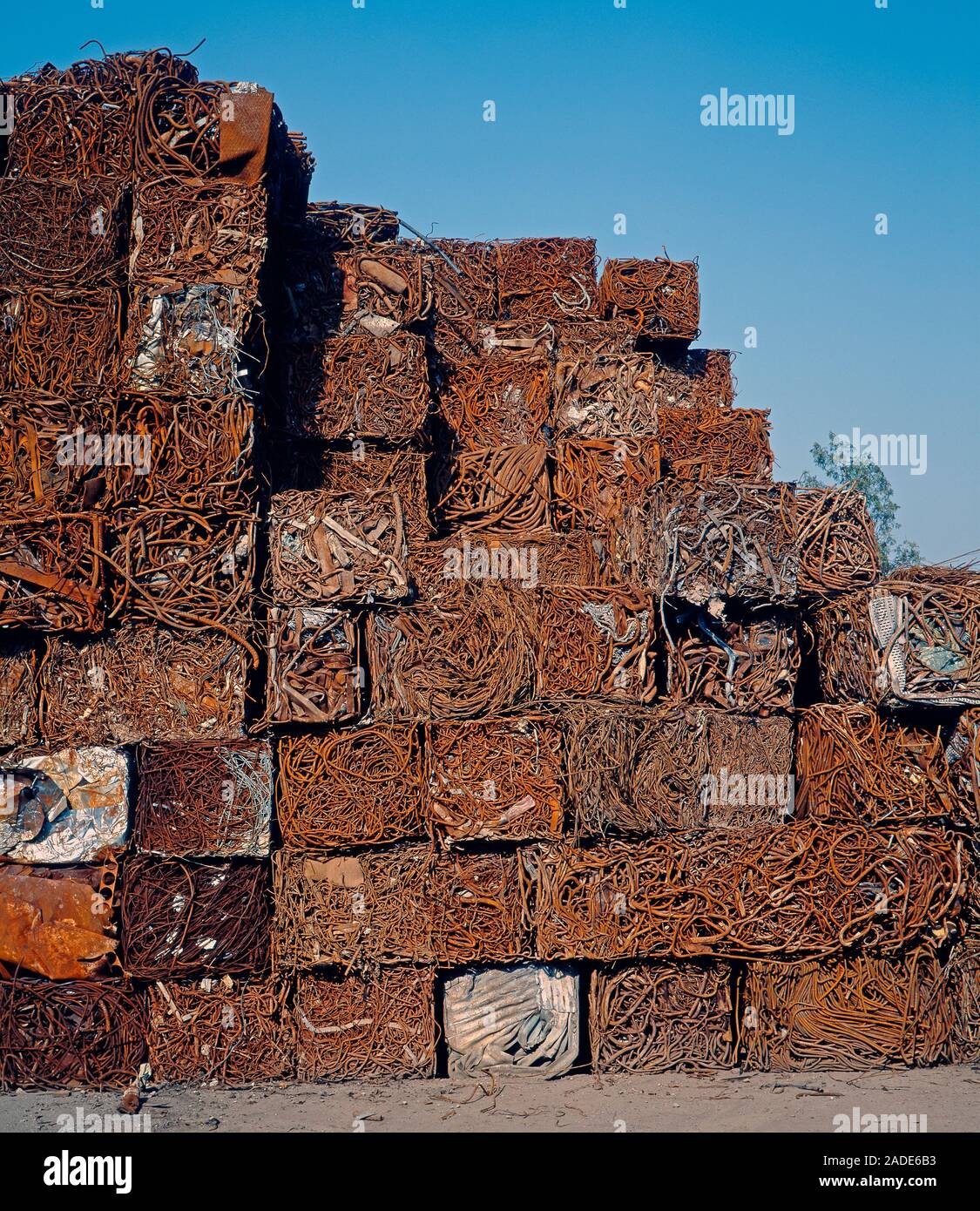 Wire mesh in a scrap metal yard compacted into square bales, destined ...