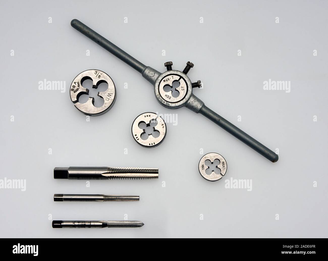 These different sized hand-operated taps and dies are tools used to ...