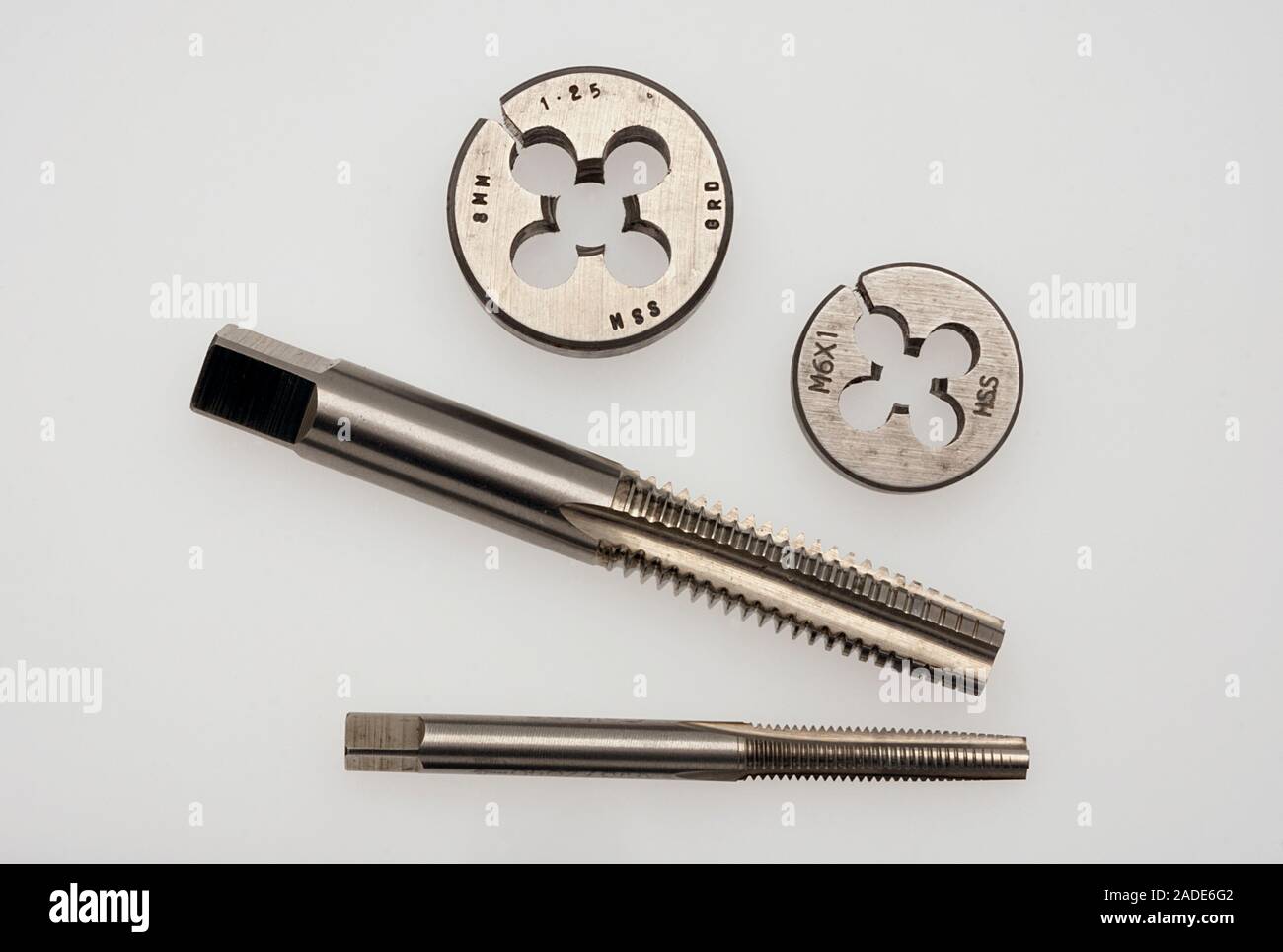 These different sized hand-operated taps and dies are tools used to ...