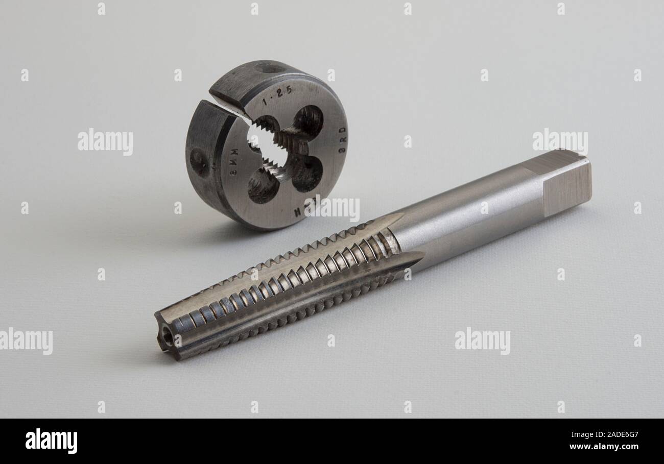 This hand-operated tap and die set illustrates the two types of tool ...