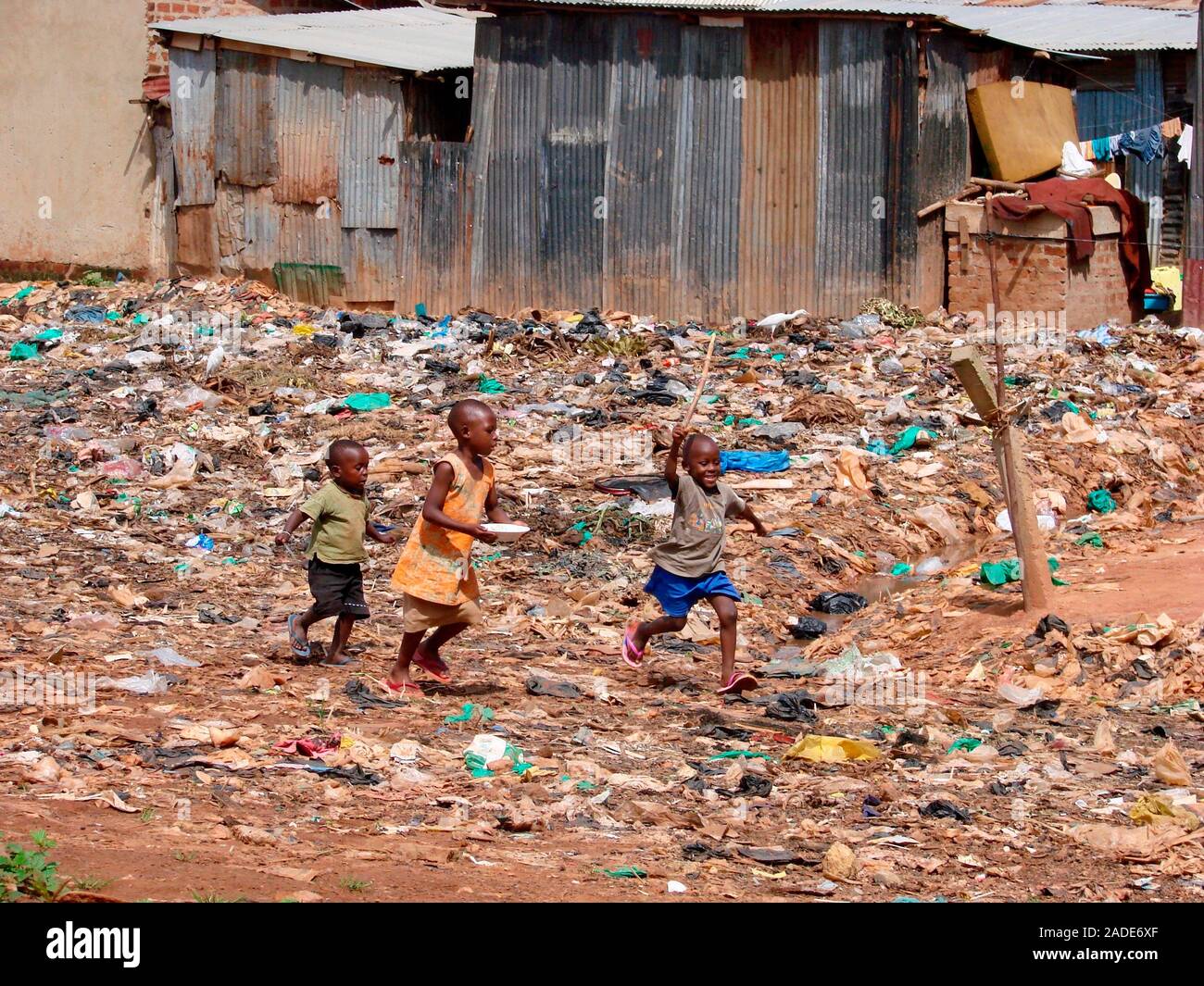 Children playing amongst refuse in Uganda, 2015 Stock Photo - Alamy