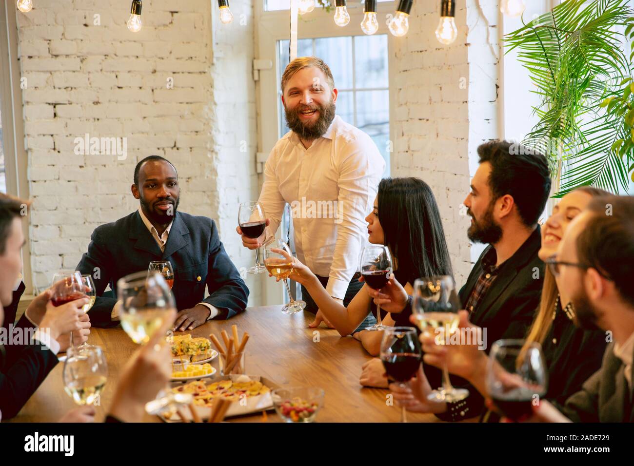 Happy co-workers celebrating while company party, corporate event ...