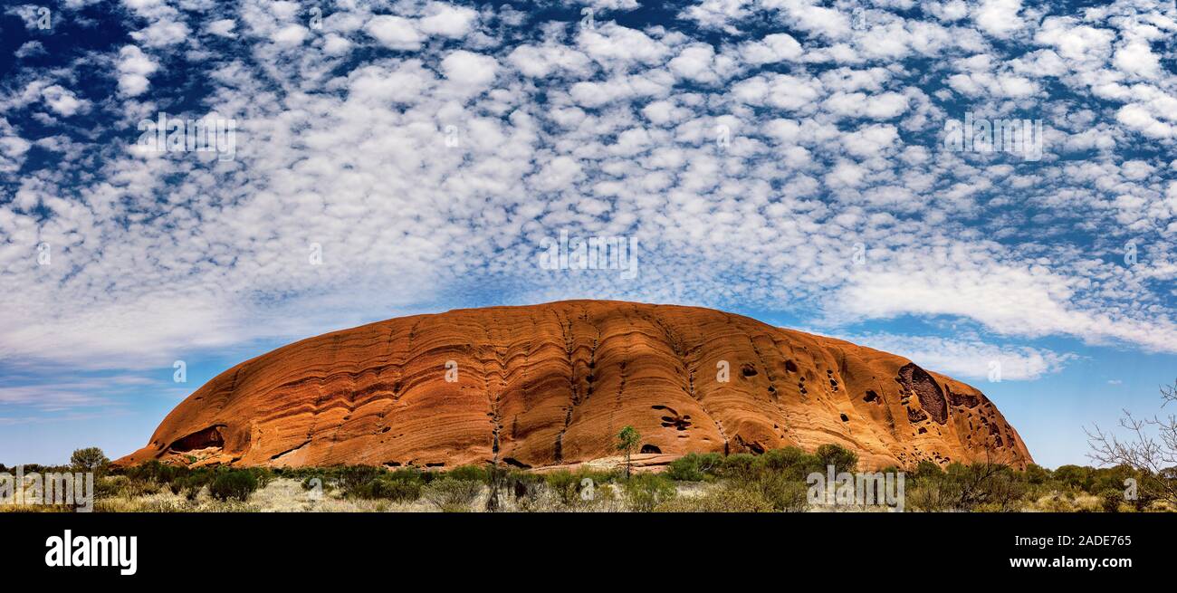 Uluru in spring, with altocumulus stratiformis clouds overhead. Uluru ...