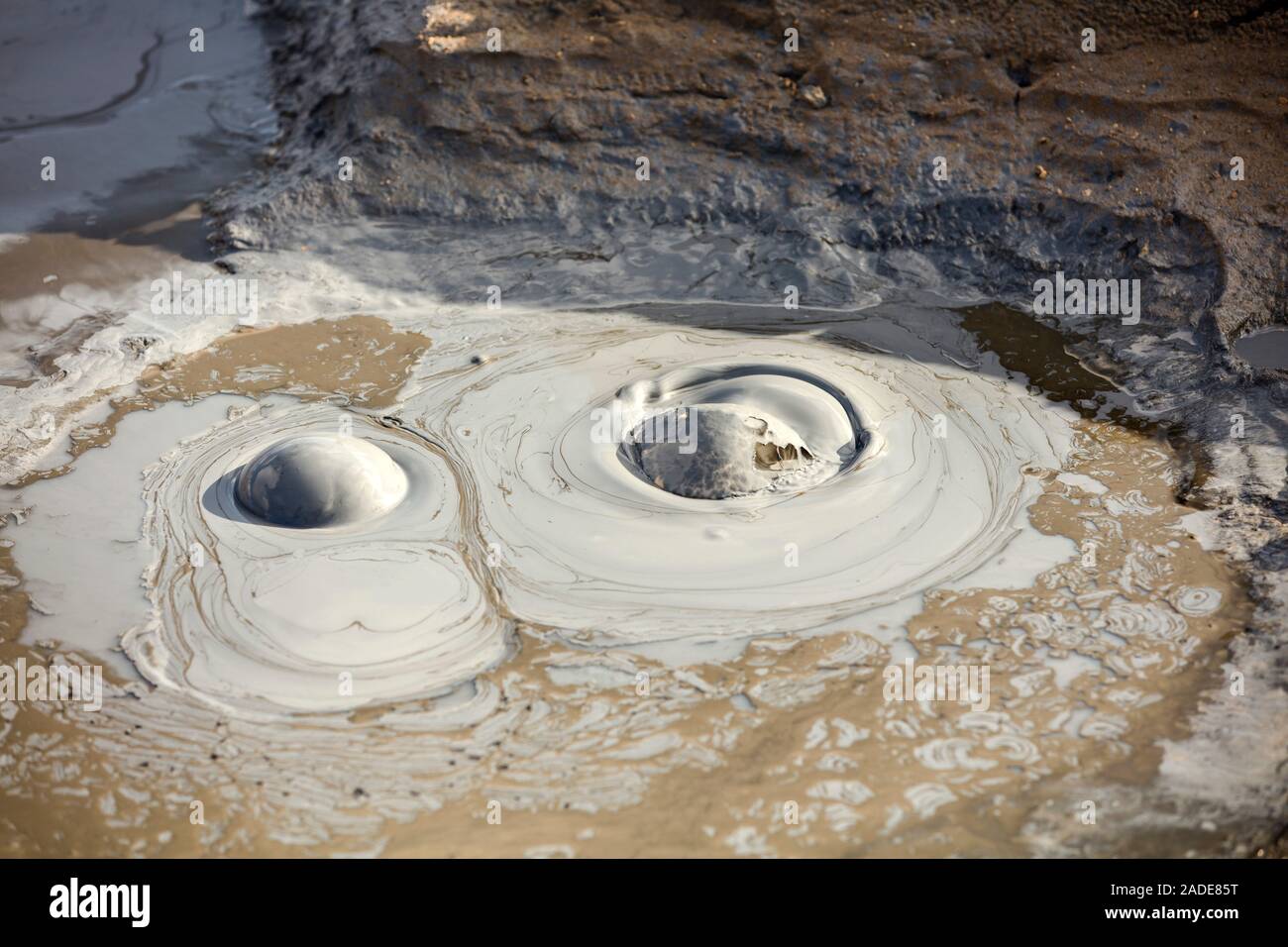 Geothermal mud pool. Bubbling mud in a mud pool in Iceland. Mud pools ...