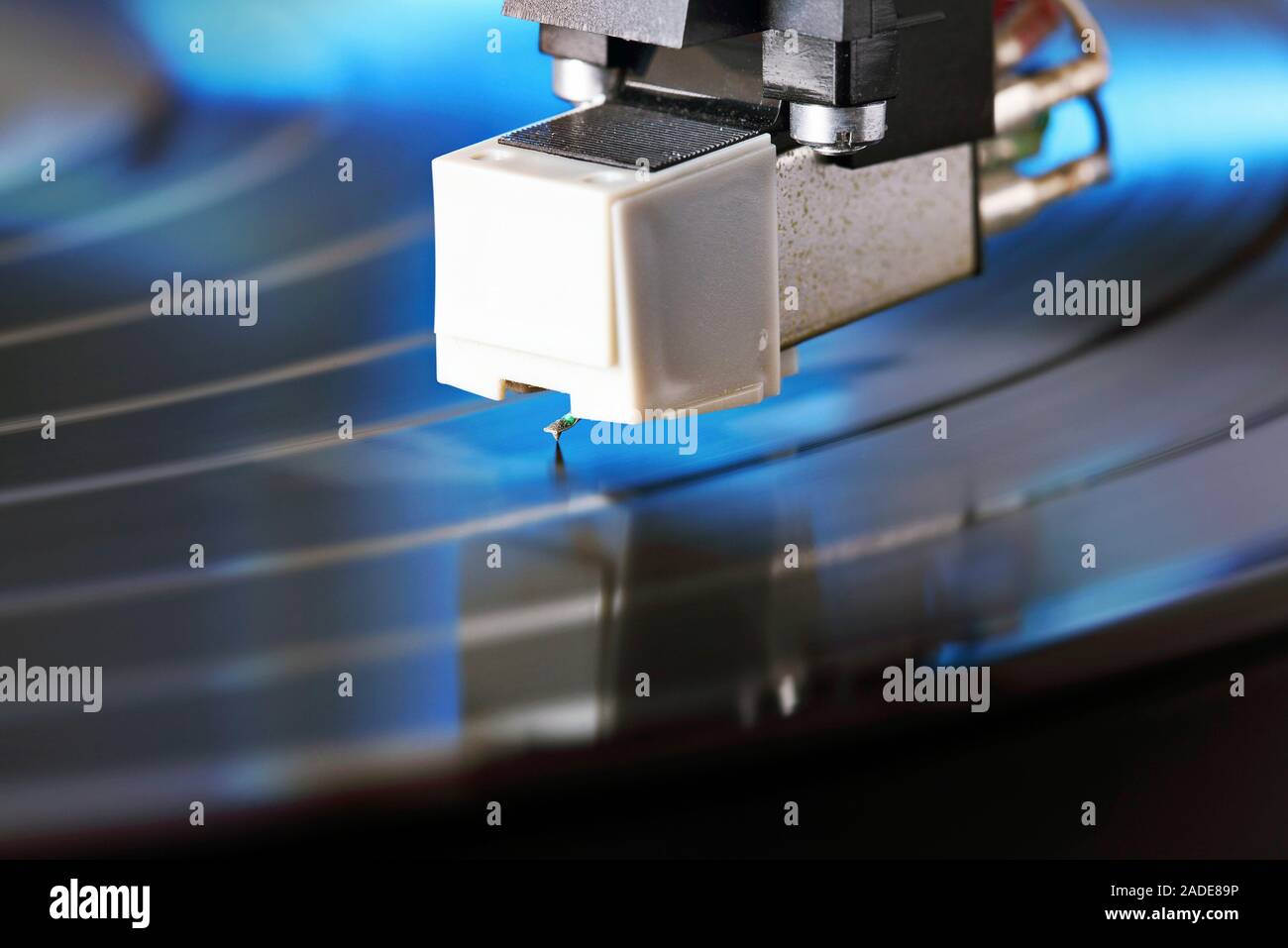 Record player stylus. Close up of a magnetic cartridge on the tone-arm ...