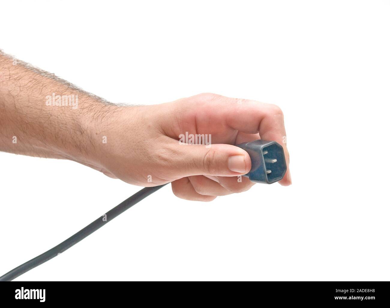 Hand with three-pin power plug Stock Photo - Alamy