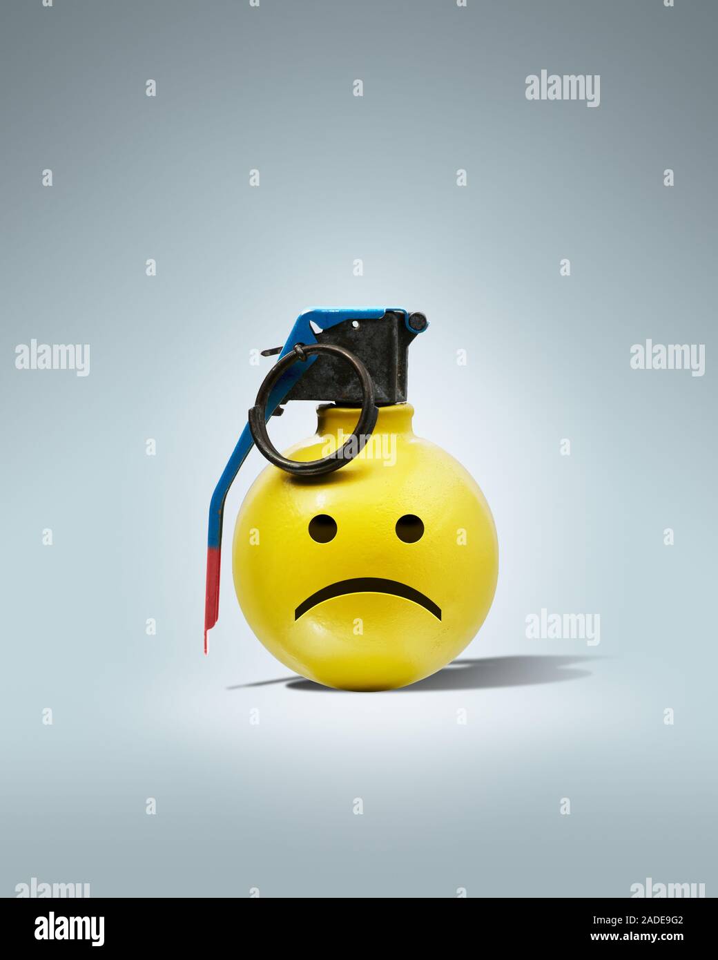 Hand grenade with sad face Stock Photo - Alamy