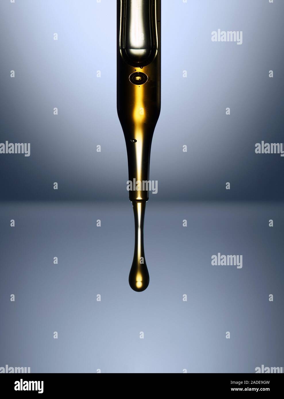 Eyedropper and oil drop Stock Photo - Alamy