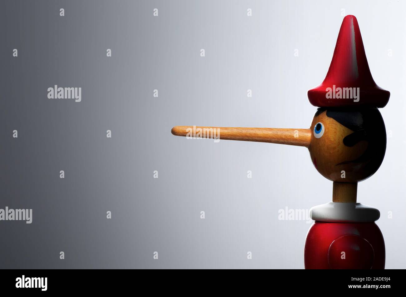 Liar, conceptual image. Pinocchio doll in profile Stock Photo - Alamy