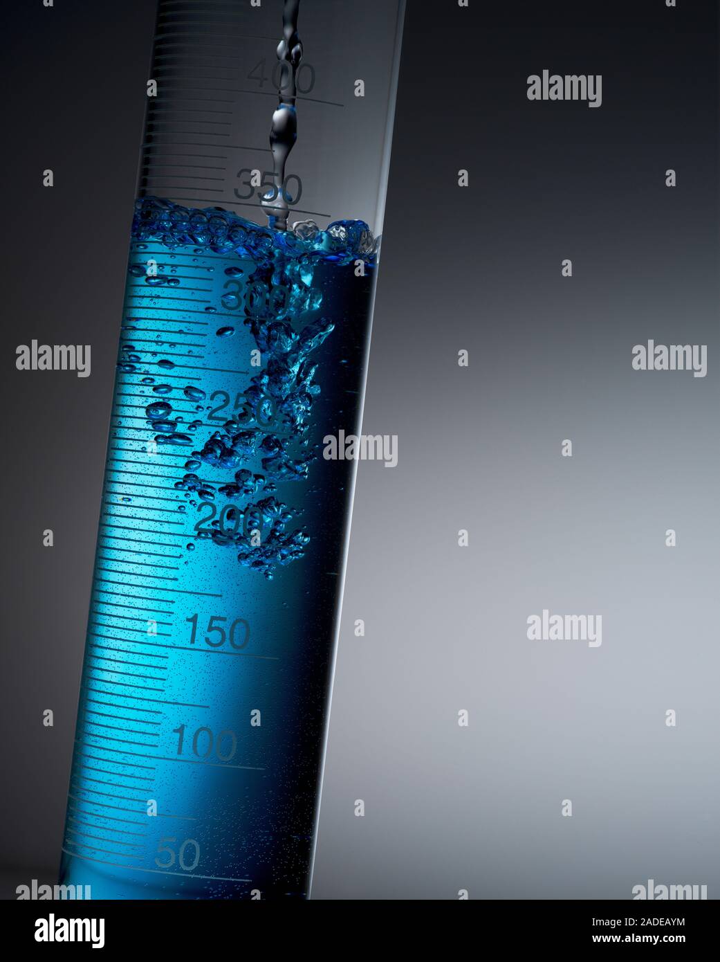 Liquid in measuring cylinder Stock Photo - Alamy