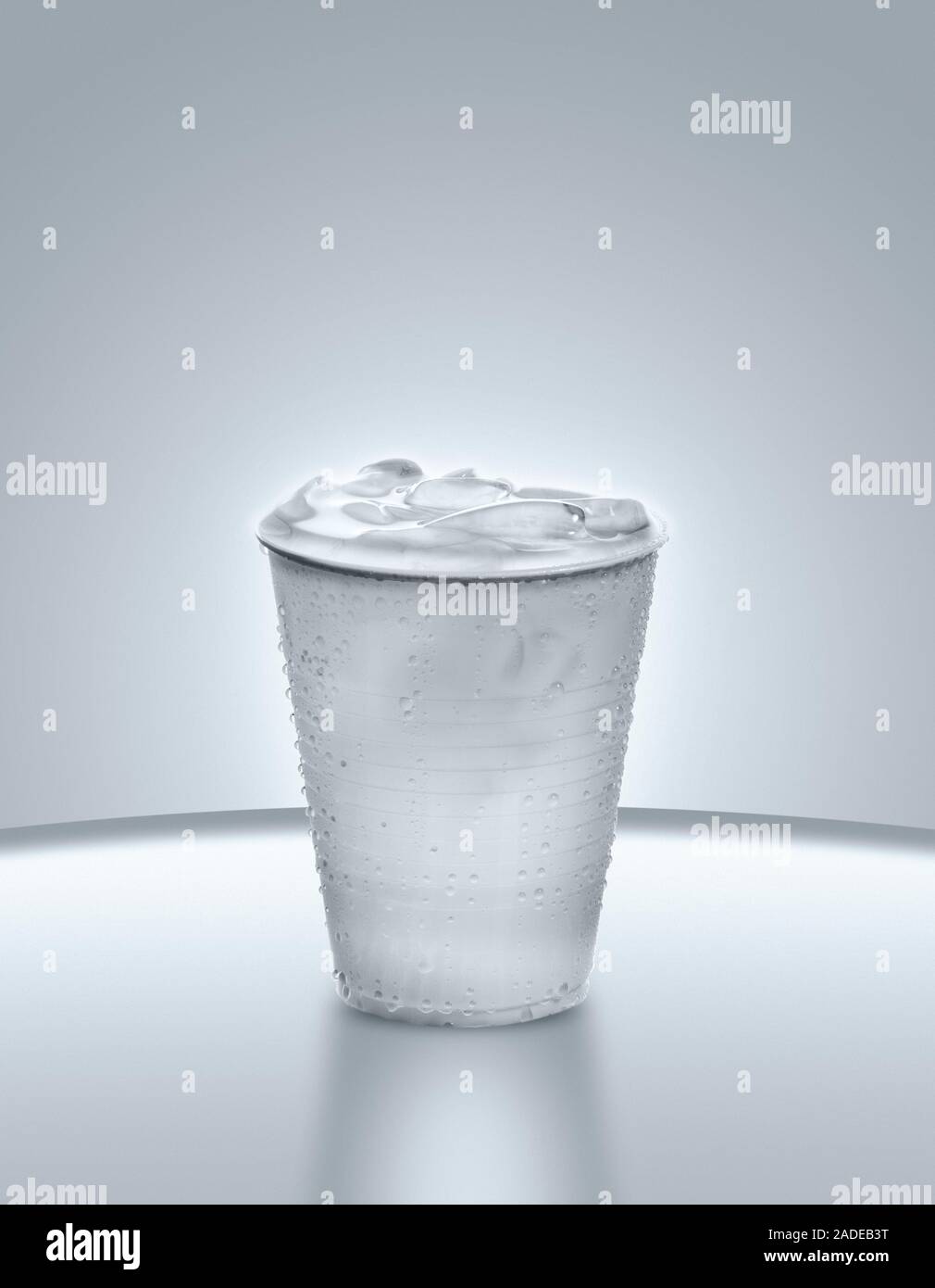 Iced water in a plastic cup Stock Photo - Alamy
