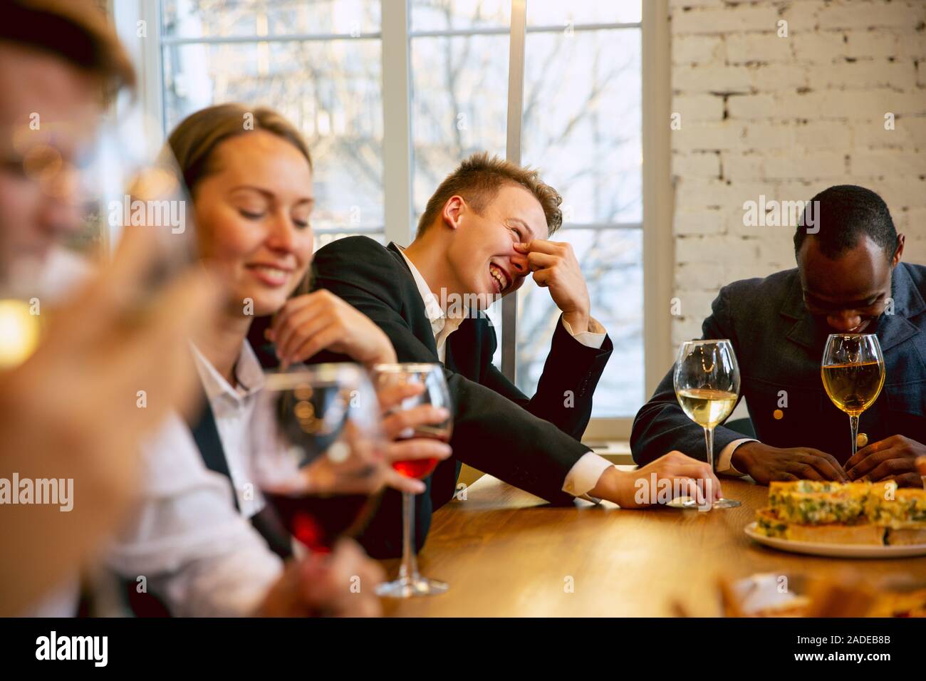 Happy co-workers celebrating while company party, corporate event ...