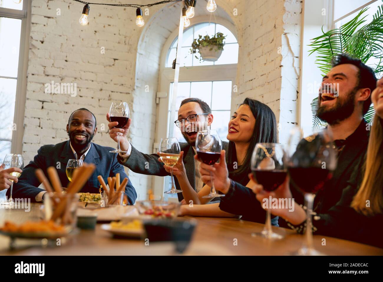 Happy co-workers celebrating while company party, corporate event ...