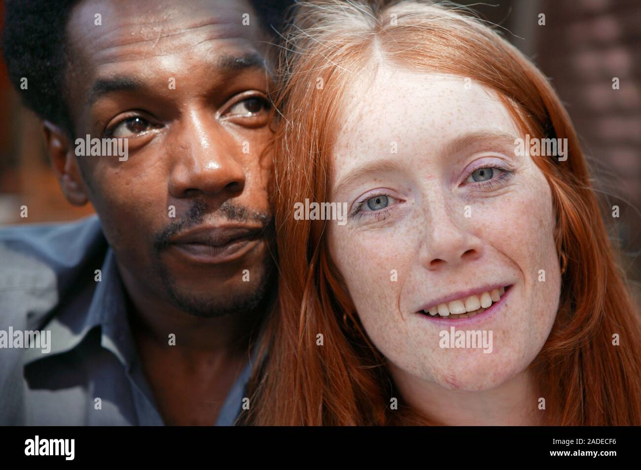 Portrait of multiracial couple outside in the sunshine Stock Photo - Alamy
