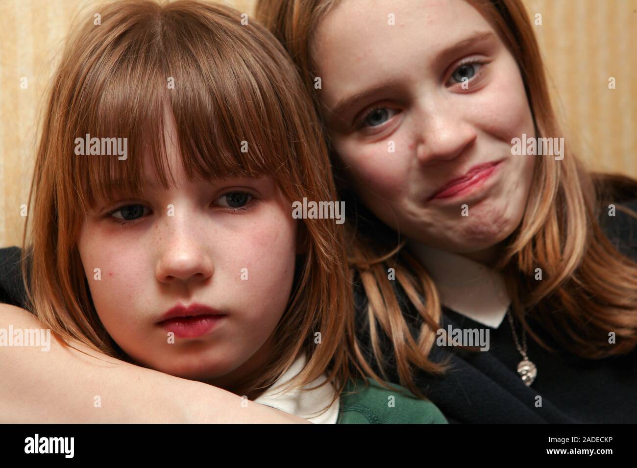 Young sisters hugging Stock Photo - Alamy