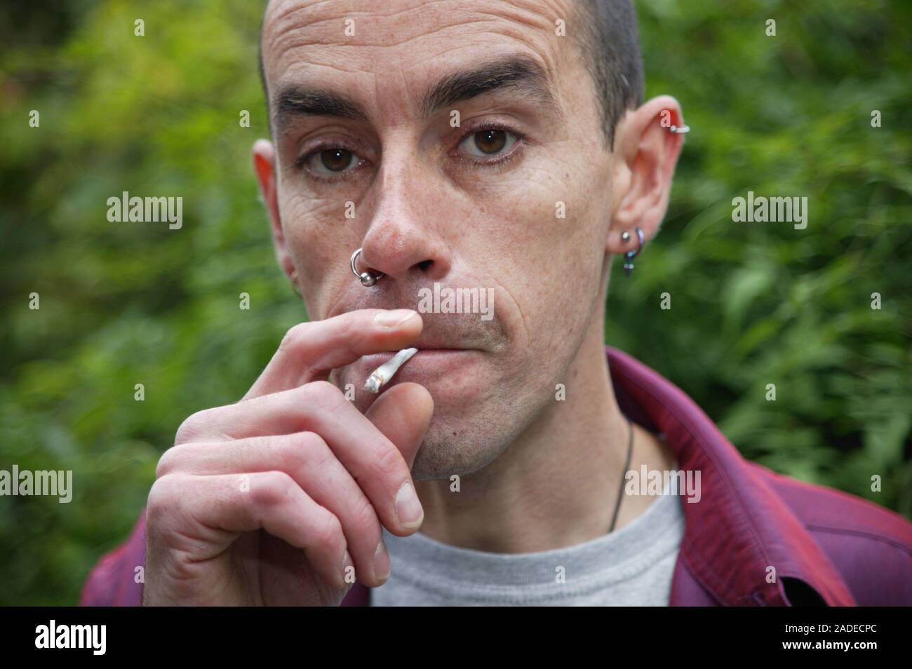 Portrait of a man smoking Stock Photo - Alamy