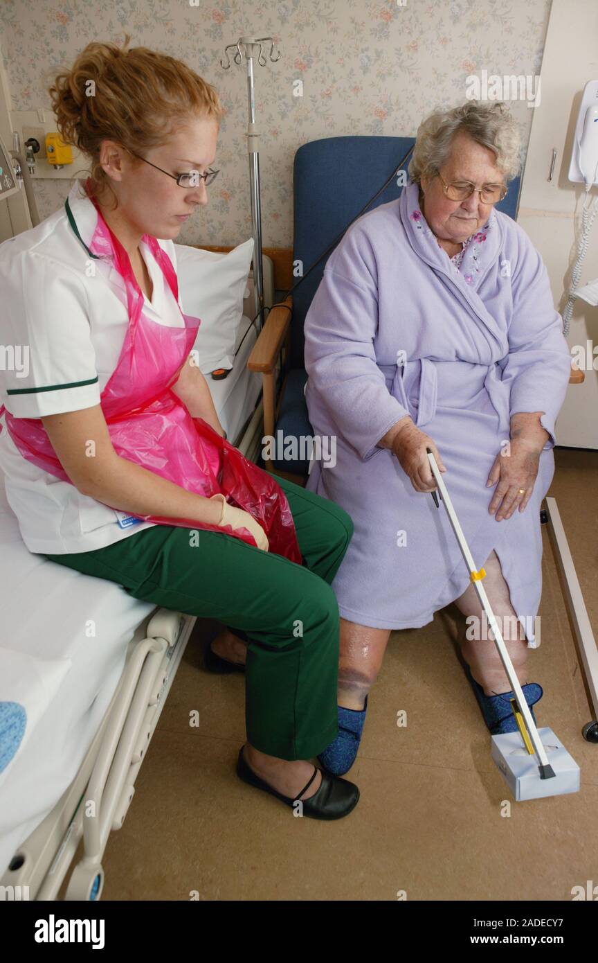 Occupational Therapist working with patient practicing how to use the ...