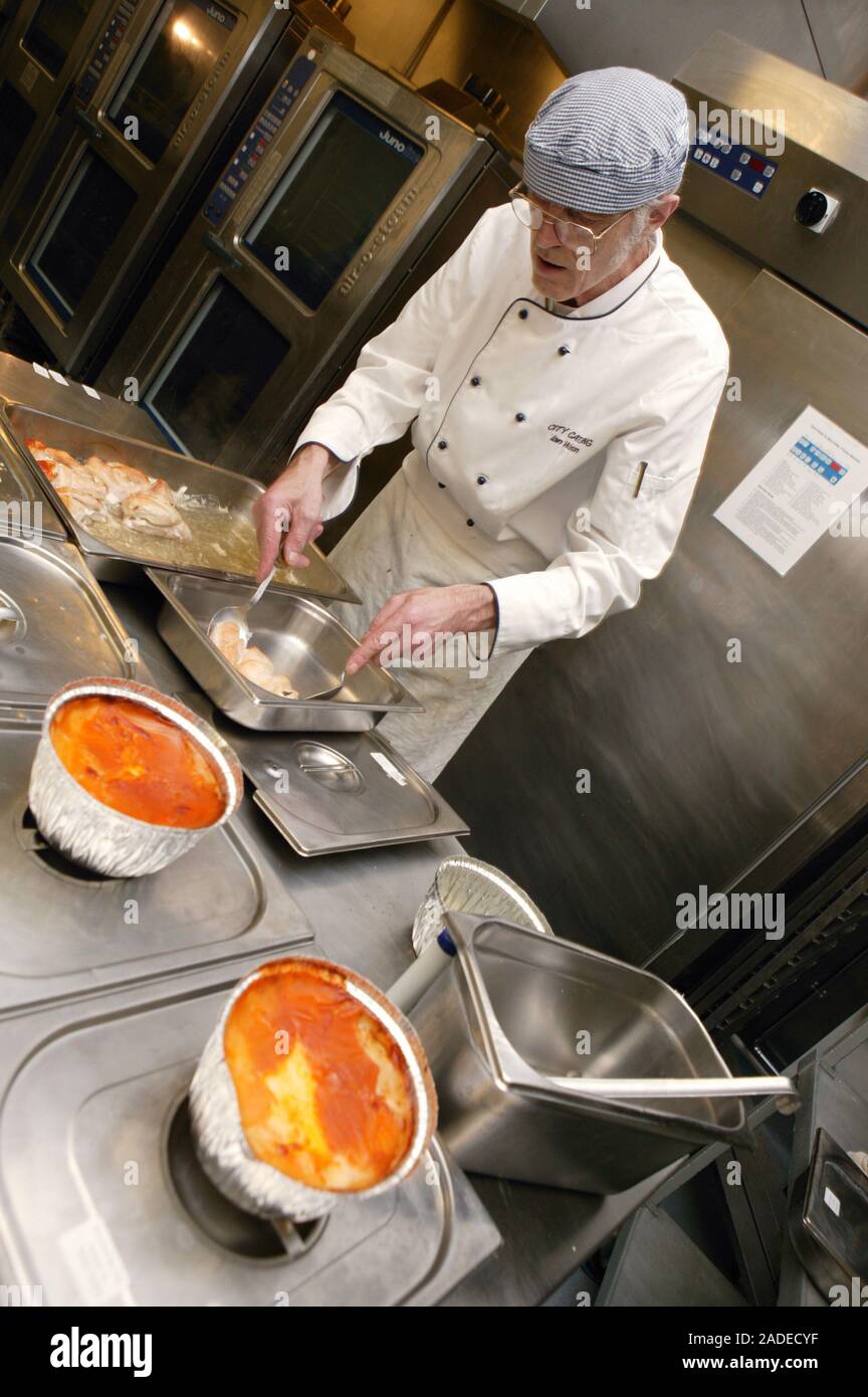 Hospital Chef transferring cooked food into gastronome containers to be ...