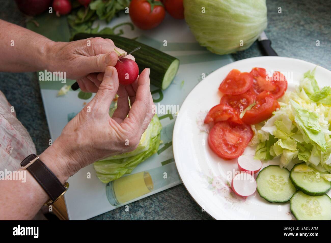 Preparing a salad Stock Photo - Alamy