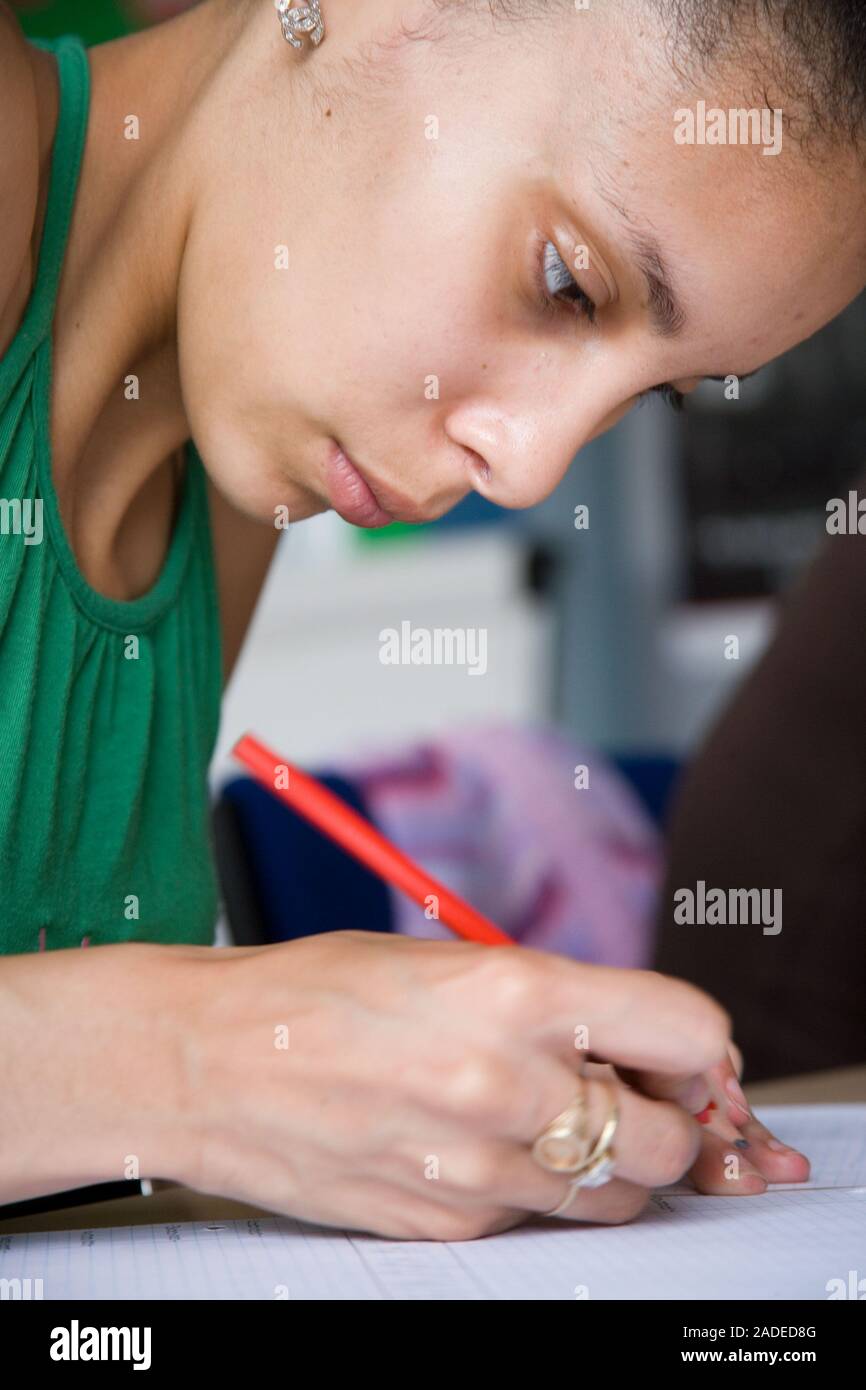 Young woman working in a numeracy and literacy class at the Aspire ...