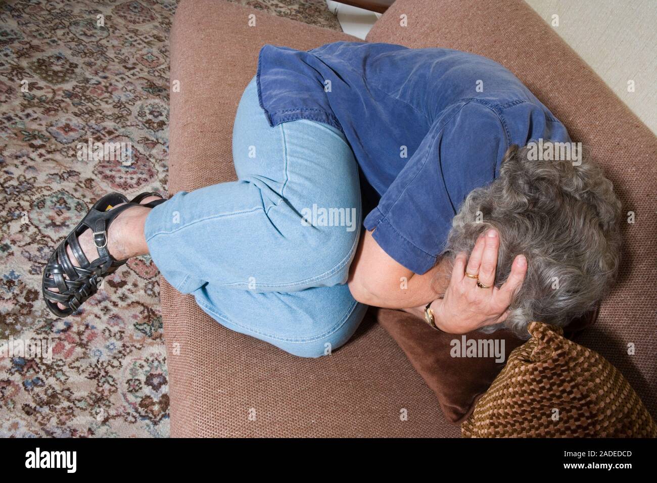 Older woman cowering in fear Stock Photo - Alamy