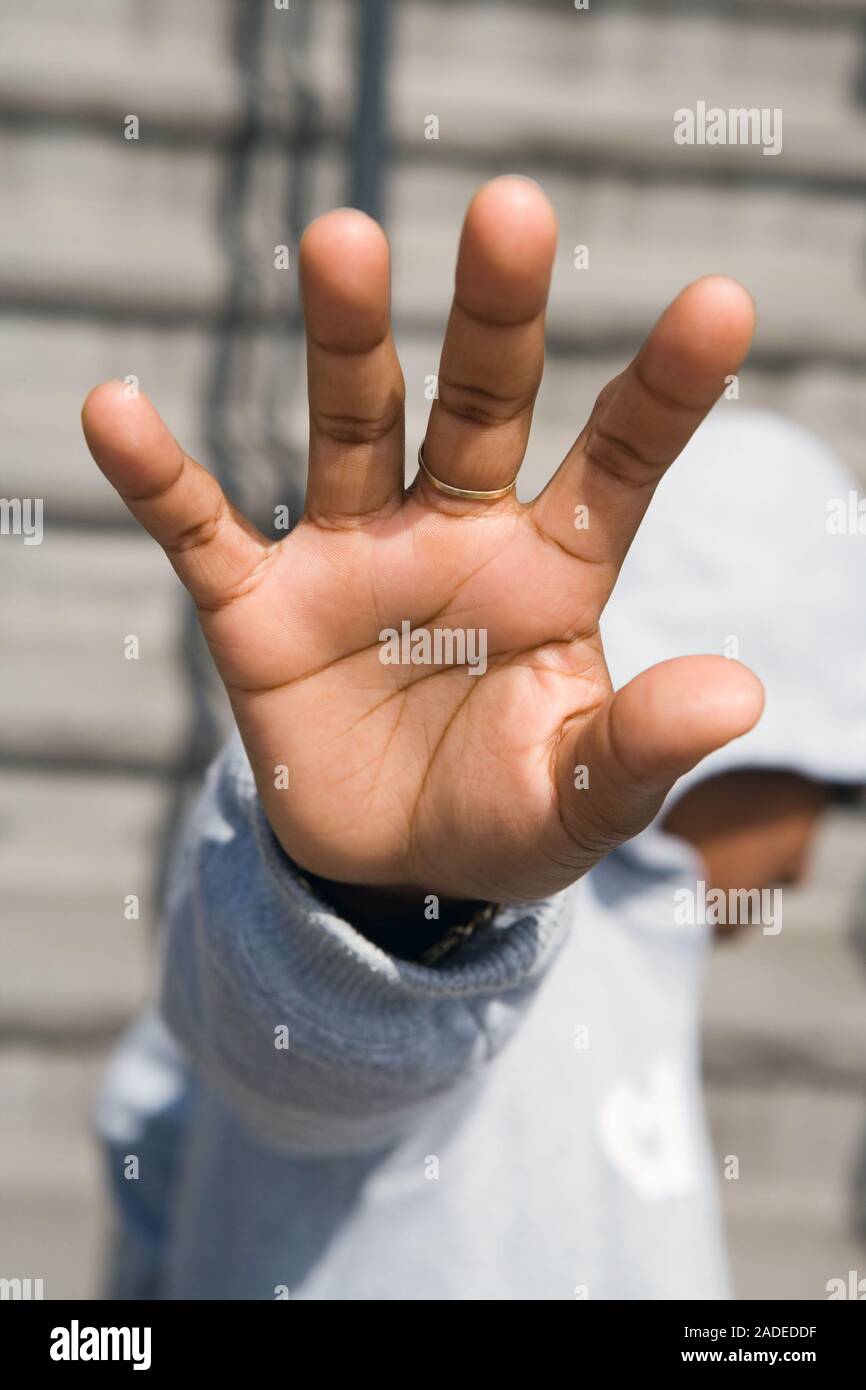 Boy giving a talk to the hand gesture Stock Photo - Alamy